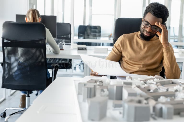 Dark-skinned Young Architect Working in the Office and Looking Tired ...