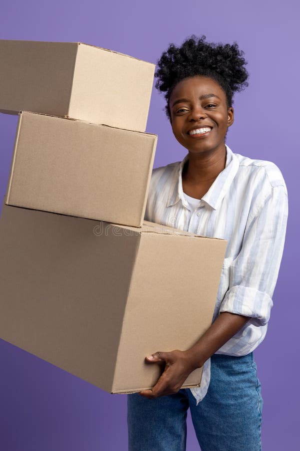 Dark-skinned Young Woman with Boxes in Hands Looking Contented Stock ...