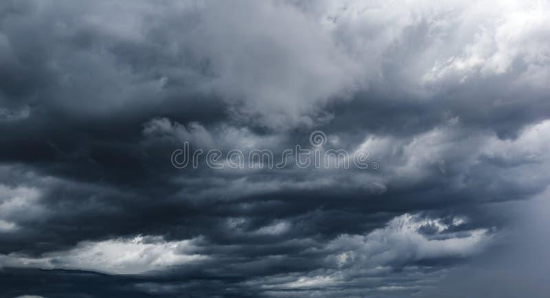 The Dark Sky with Heavy Clouds Converging and a Violent Storm before ...