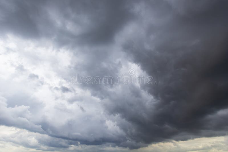 The Dark Sky with Heavy Clouds Converging and a Violent Storm before ...
