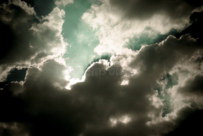 Sun Ray Shine Through Dark Cloud In The Sunrise Sky. Stock Image ...