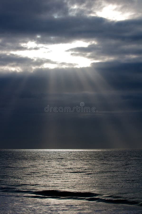Dark sky sun rays stock image. Image of ocean, dark, storm - 19768303