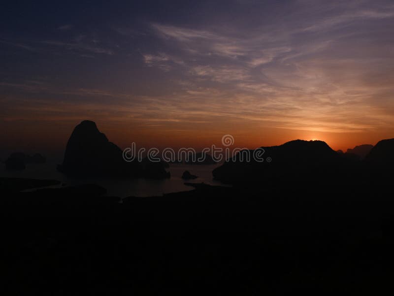 A Dark Sky with a Sun Setting in the Distance Stock Image - Image of ...