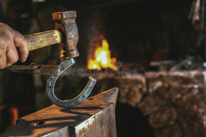 Dark Smithy with Blacksmith Tools, Horseshoe Stock Photo - Image of ...