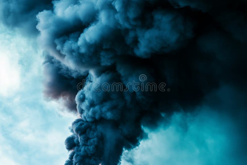 Dark Smoke Billowing into the Sky from a Distant Location during an ...