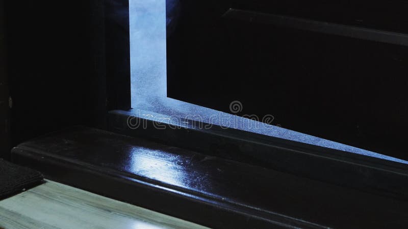 Dark Smoke is Coming from Under the Half-open Door into the Rooms Below ...