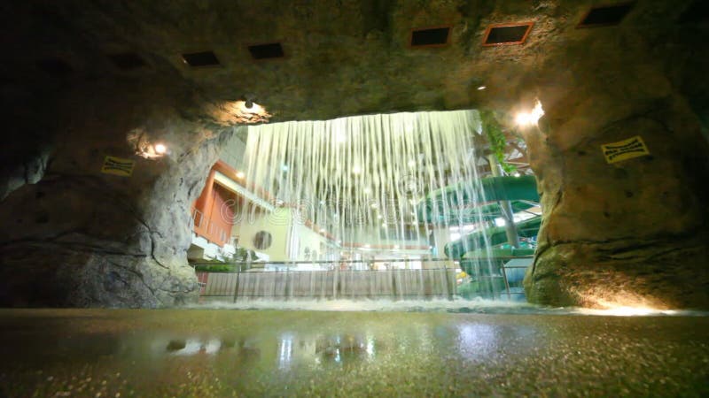 Dark Stone Cave with a Waterfall in a Large Indoor Stock Video - Video ...