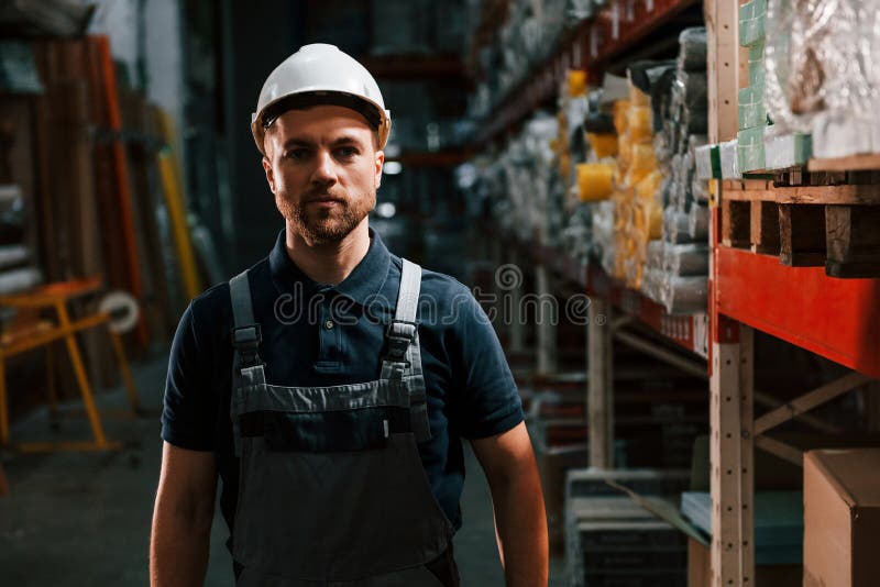 In Dark Store. Employee in Uniform is Working in the Storage Stock ...