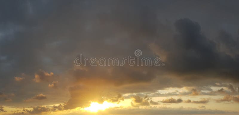 Dark Storm Cloud with Golden Sun on Dramatic Sunset Sky Stock Photo ...