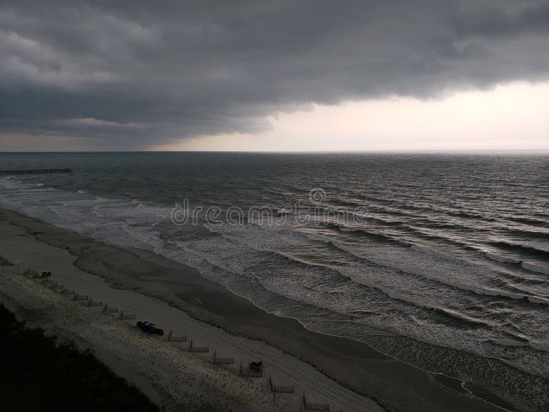 Dark and stormy beach stock photo. Image of storm, stormy - 164019112