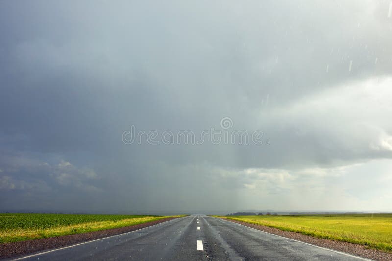 Dark Stormy Sky and Clouds and a Wet Road in the Rain Stock Photo ...