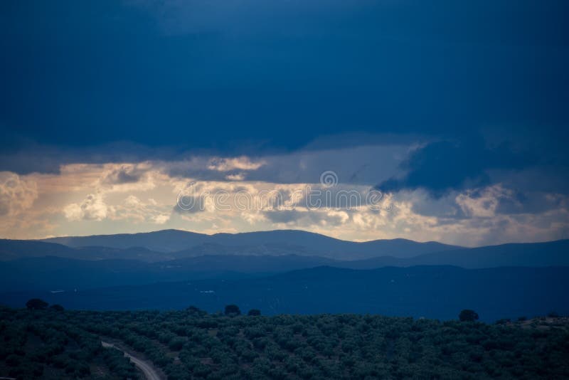 Dark Stormy Sky with Olive Fields in the Foreground Stock Photo - Image ...
