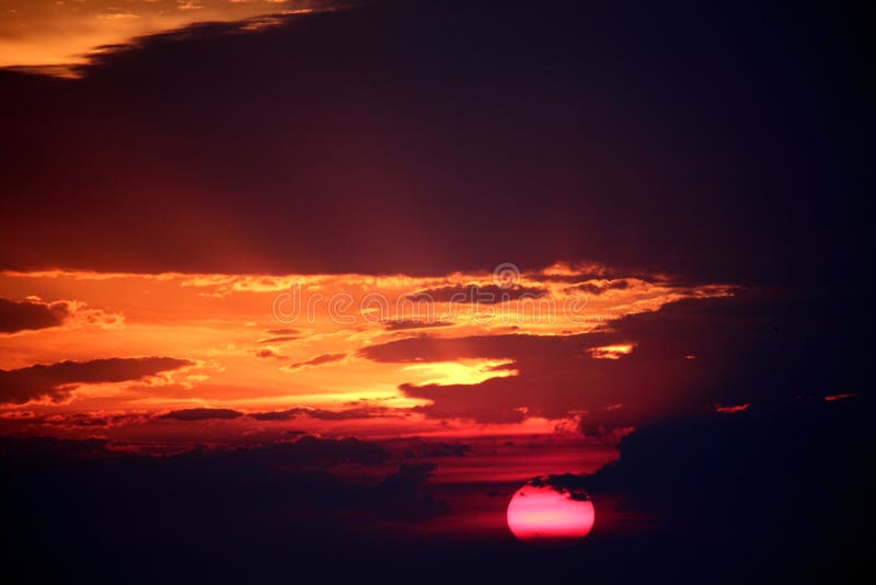 Dark sunset and pink sun stock photo. Image of dramatic - 95716990