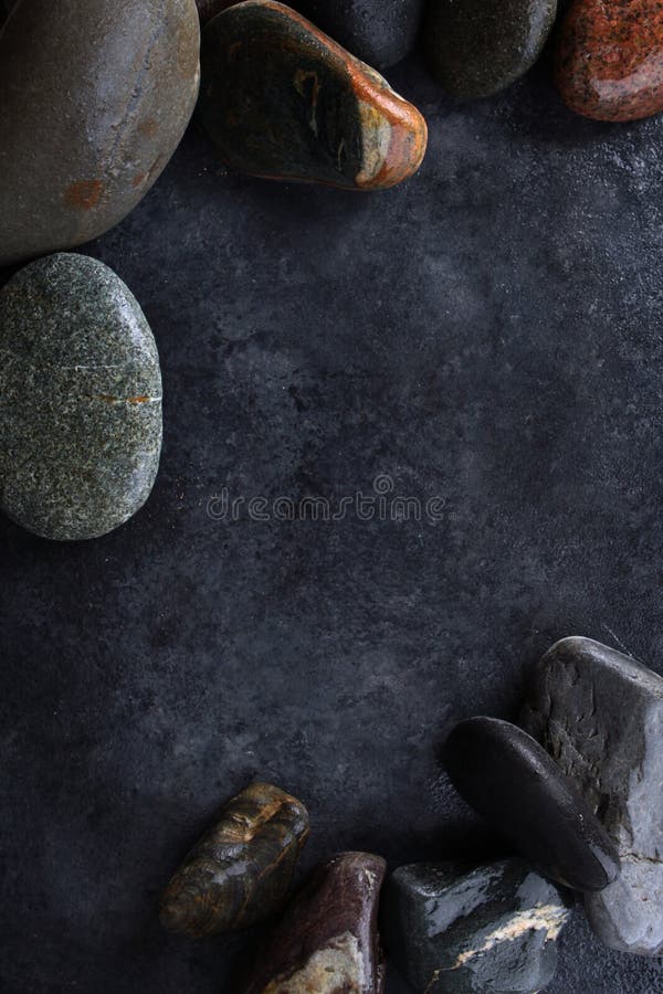 Dark Textured Background . Stones on a Black Background. Smooth Stones ...