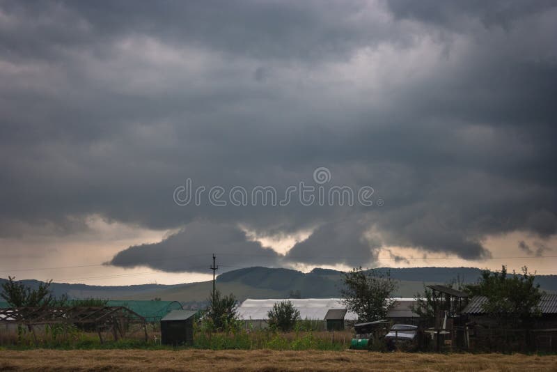 Dark Threatening Storm Clouds Over a Hill in the Countryside Stock ...