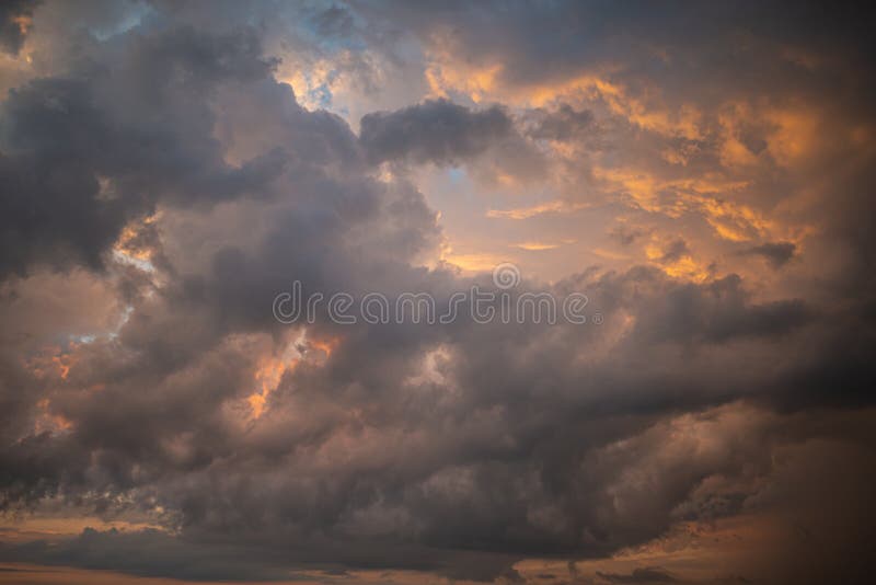 A Dark Thundercloud on the Background of Sunset Stock Photo - Image of ...