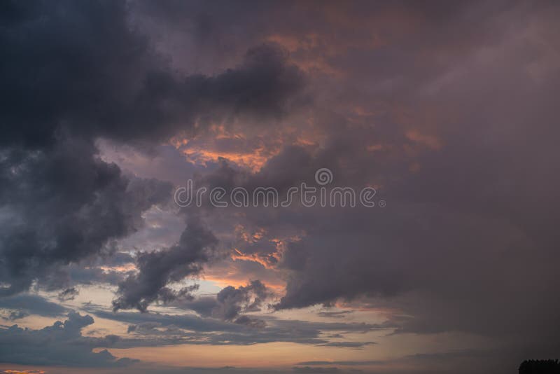 A Dark Thundercloud on the Background of Sunset Stock Image - Image of ...