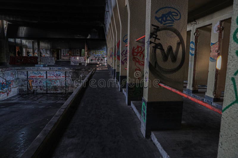Dark Walkway Inside Abandoned Graffiti-Filled Swimming Pool Complex ...