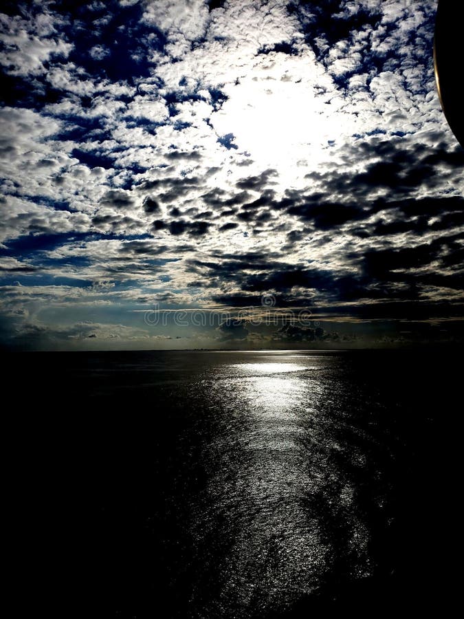 Dark and Light Blue Sky with Angry Gray Storm Clouds and a Golden ...