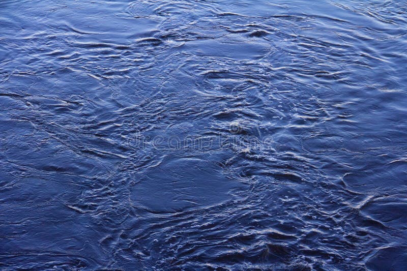 Dark Water Surface with Ripple and Waves. Abstract Texture of Flowing ...