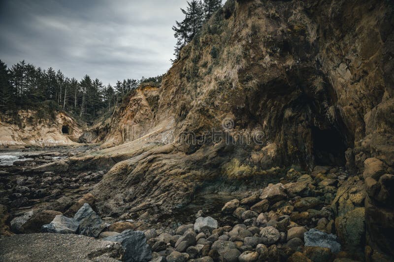 The Dark Waters are Flowing Down the Rocks and into the Cave Stock ...