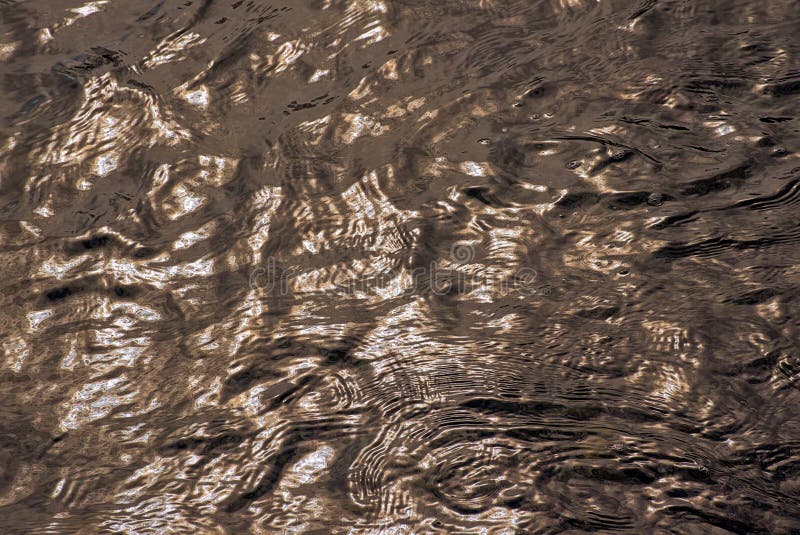 Dark Wavy Water with Bright Reflection of Sunlight. Stock Photo - Image ...