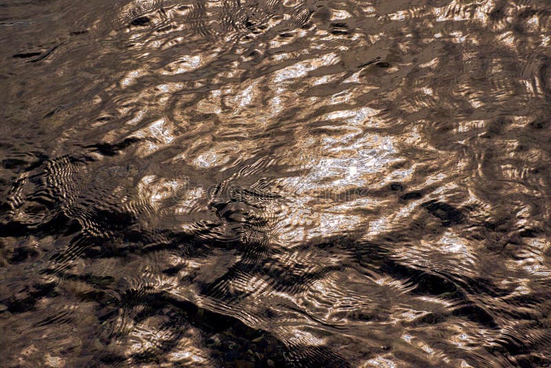 Dark Wavy Water with Bright Reflection of Sunlight. Stock Photo - Image ...