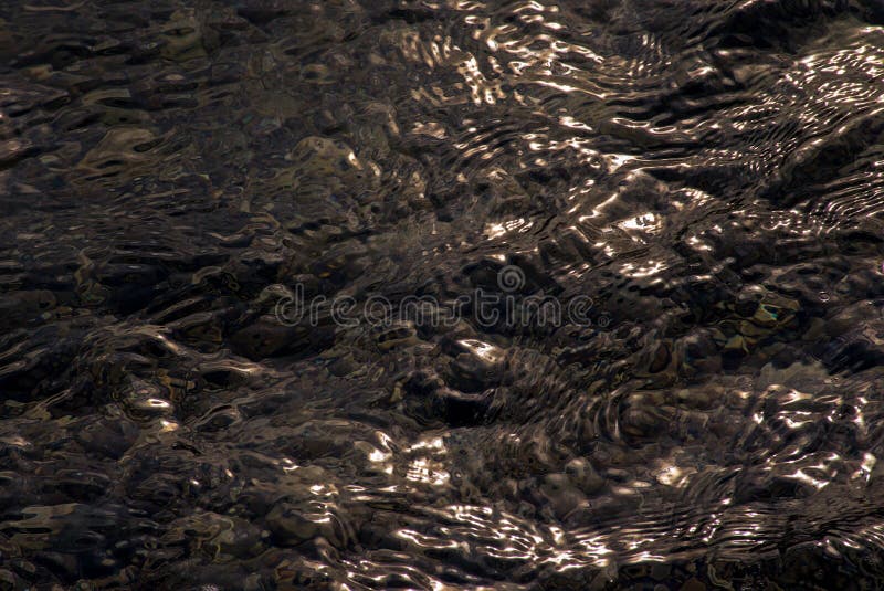 Dark Wavy Water with Bright Reflection of Sunlight. Stock Image - Image ...