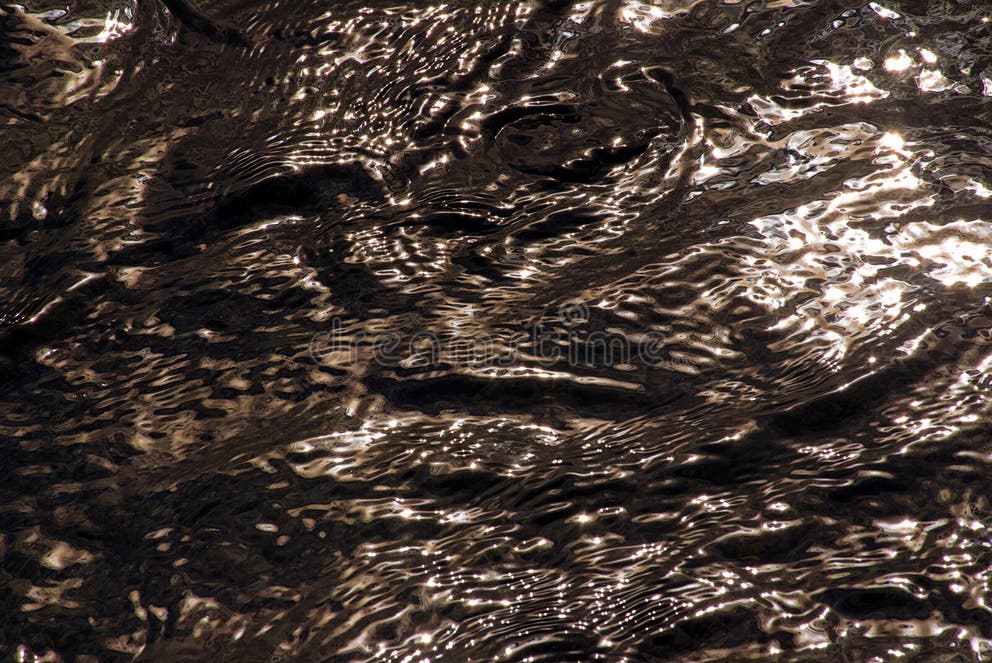 Dark Wavy Water with Bright Reflection of Sunlight. Stock Image - Image ...