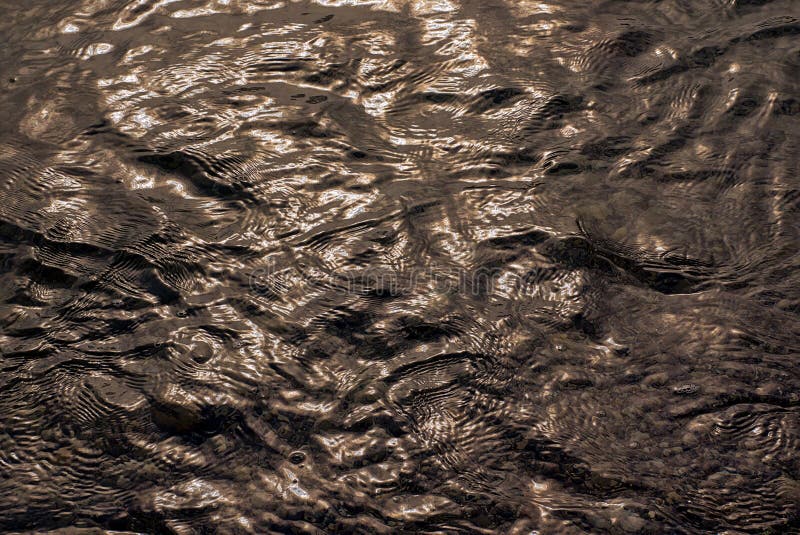 Dark Wavy Water with Bright Reflection of Sunlight. Stock Image - Image ...