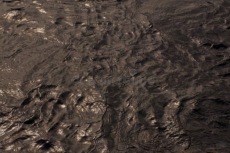 Dark Wavy Water with Bright Reflection of Sunlight. Stock Photo - Image ...