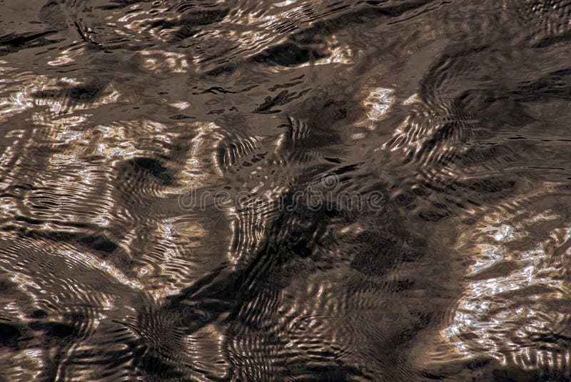 Dark Wavy Water with Bright Reflection of Sunlight. Stock Photo - Image ...