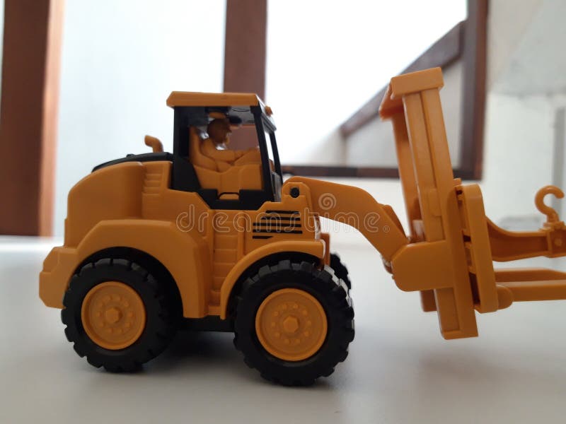 A Dark Yellow Loader Toy Car on a White Background, Stock Image - Image ...