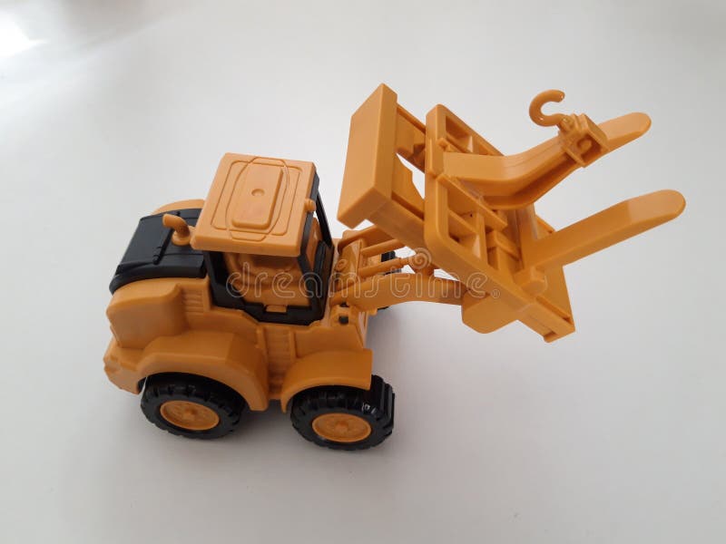 A Dark Yellow Loader Toy Car on a White Background, Stock Image - Image ...