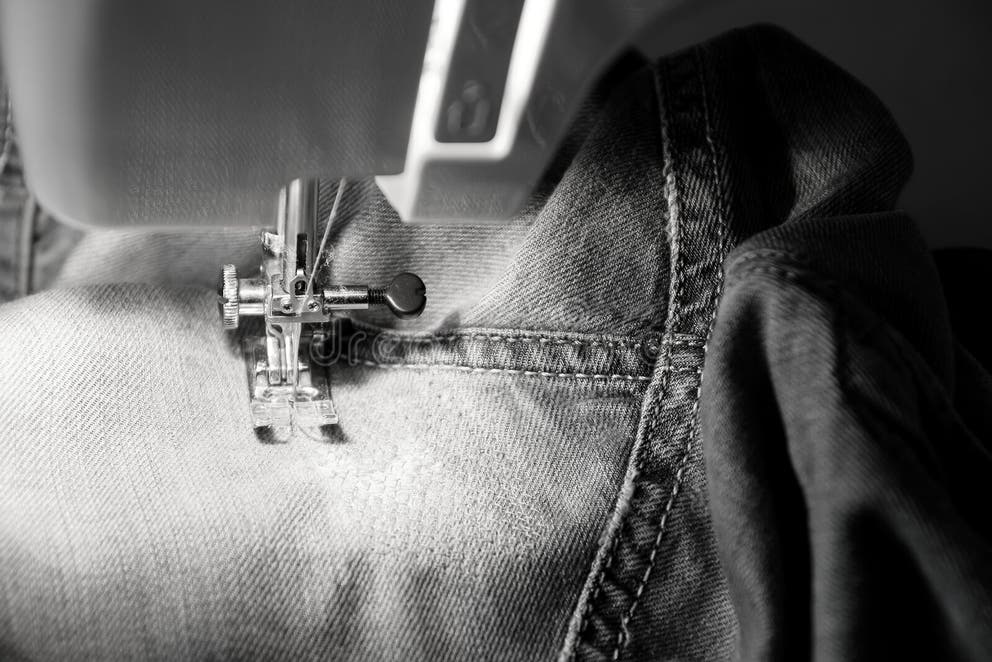 Darn jeans on the machine stock photo. Image of darning - 49257106