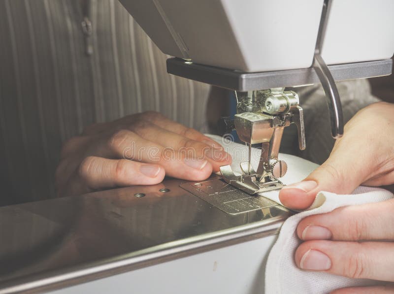 Darning Jeans on a Sewing Machine. Stock Photo - Image of darning ...