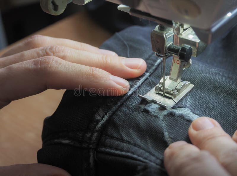 Darning Jeans on a Sewing Machine. Stock Image - Image of presser, hand ...