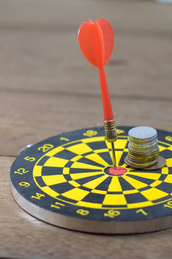 Dart Board and Arrow with Stack Coins on Desk. Stock Photo - Image of ...