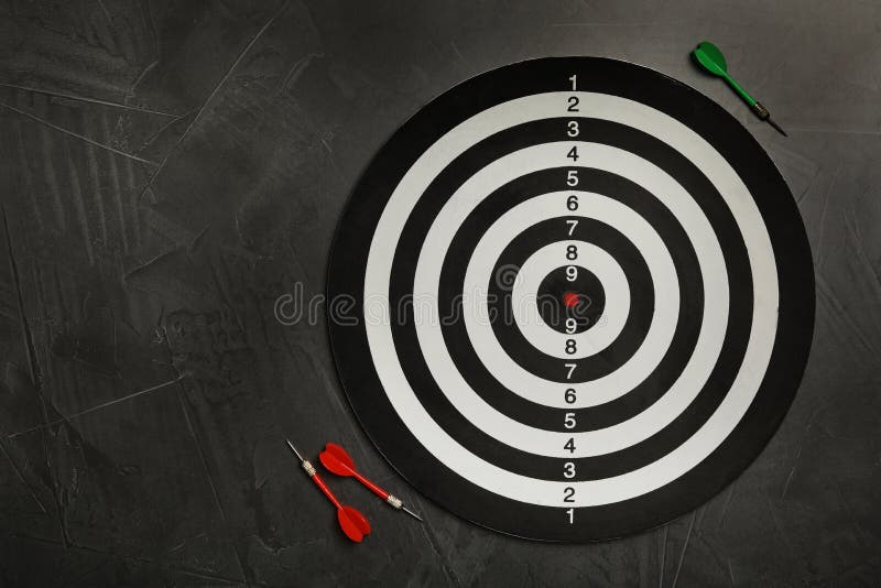 Dart Board with Color Arrows on Grey Stone Background Stock Photo ...