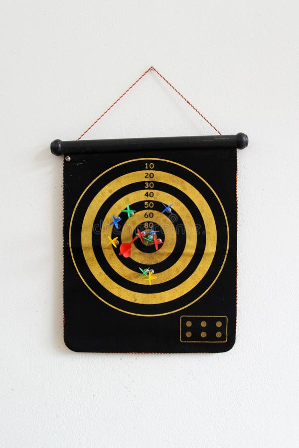 Dart Board with Darts on the Wall Stock Image - Image of yellow ...