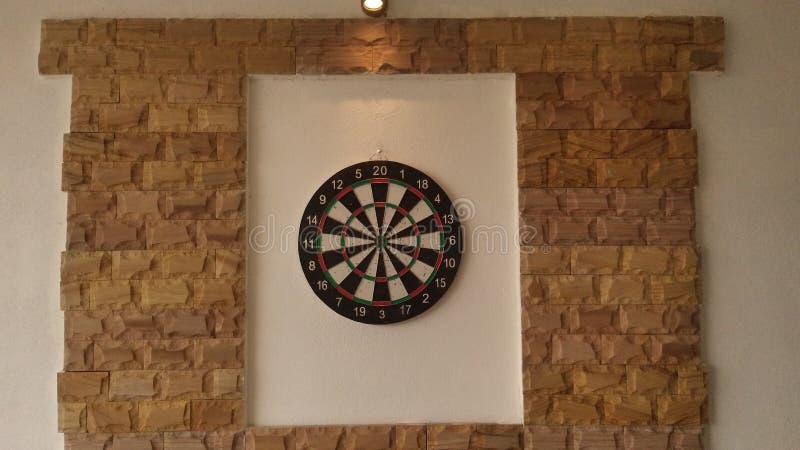 A Dart board on a wall stock photo. Image of wall, dart - 288966910