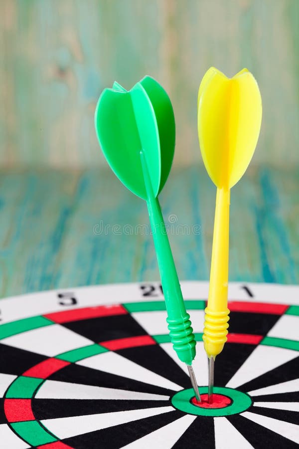 Dart stuck in a board stock photo. Image of competition - 61838086