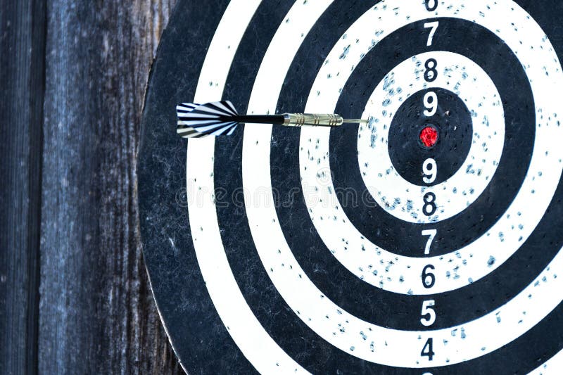 Dartboard Against Old Tree Background. Two Darts Hit the Target of a ...