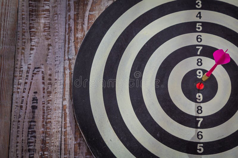 Dartboard with Darts Stuck Right in Center of the Target Stock Image ...