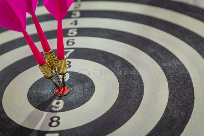 Dartboard with Darts Stuck Right in Center of the Target Stock Image ...