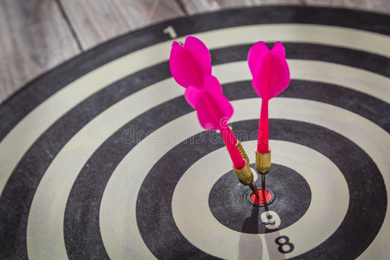 Dartboard with Darts Stuck Right in Center of the Target Stock Image ...