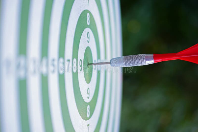 Dartboard with a Red Dart in the Center. Stock Image - Image of ...