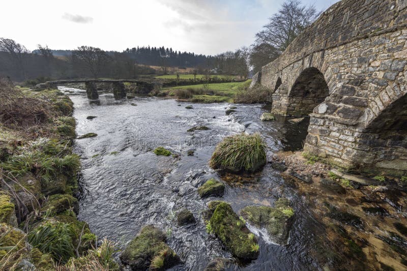 Dartmoor Clapper Bridge with Strong Flowing River Stock Image - Image ...