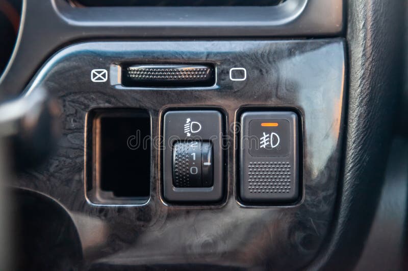 The Dashboard of the Car S Interior is Black with a Dipped Headlamp ...