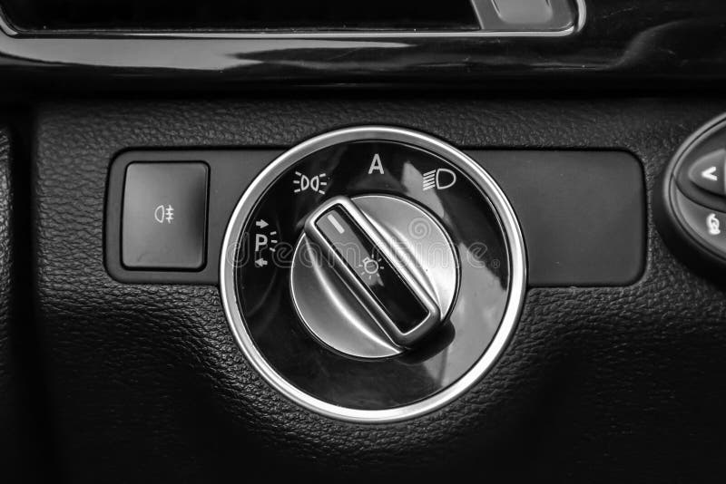 The Dashboard of the Car`s Interior is Black with a Dipped Headlamp ...